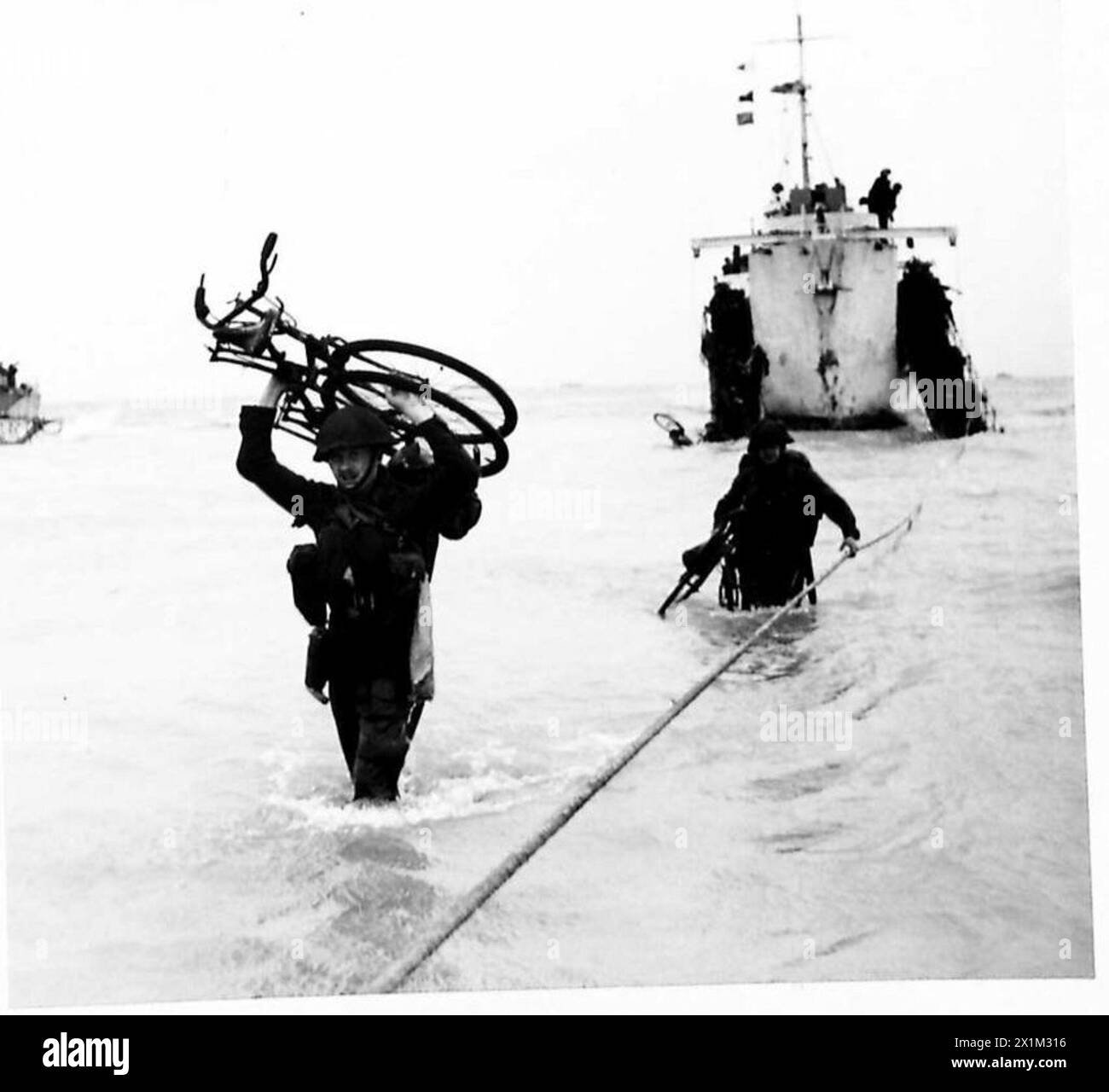 EXERCISE "FABIUS" - Troops carrying cycles ashore, British Army Stock ...