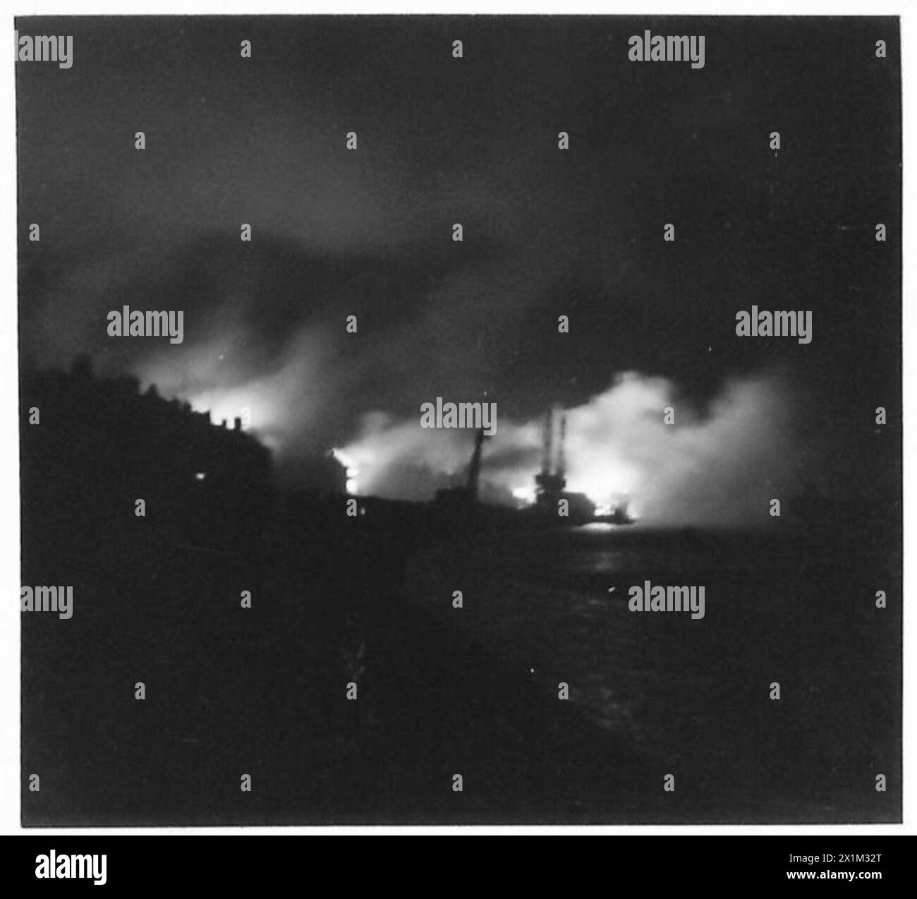 ENEMY BOMB EAST COAST TOWN - An impressive picture of the fires burning ...