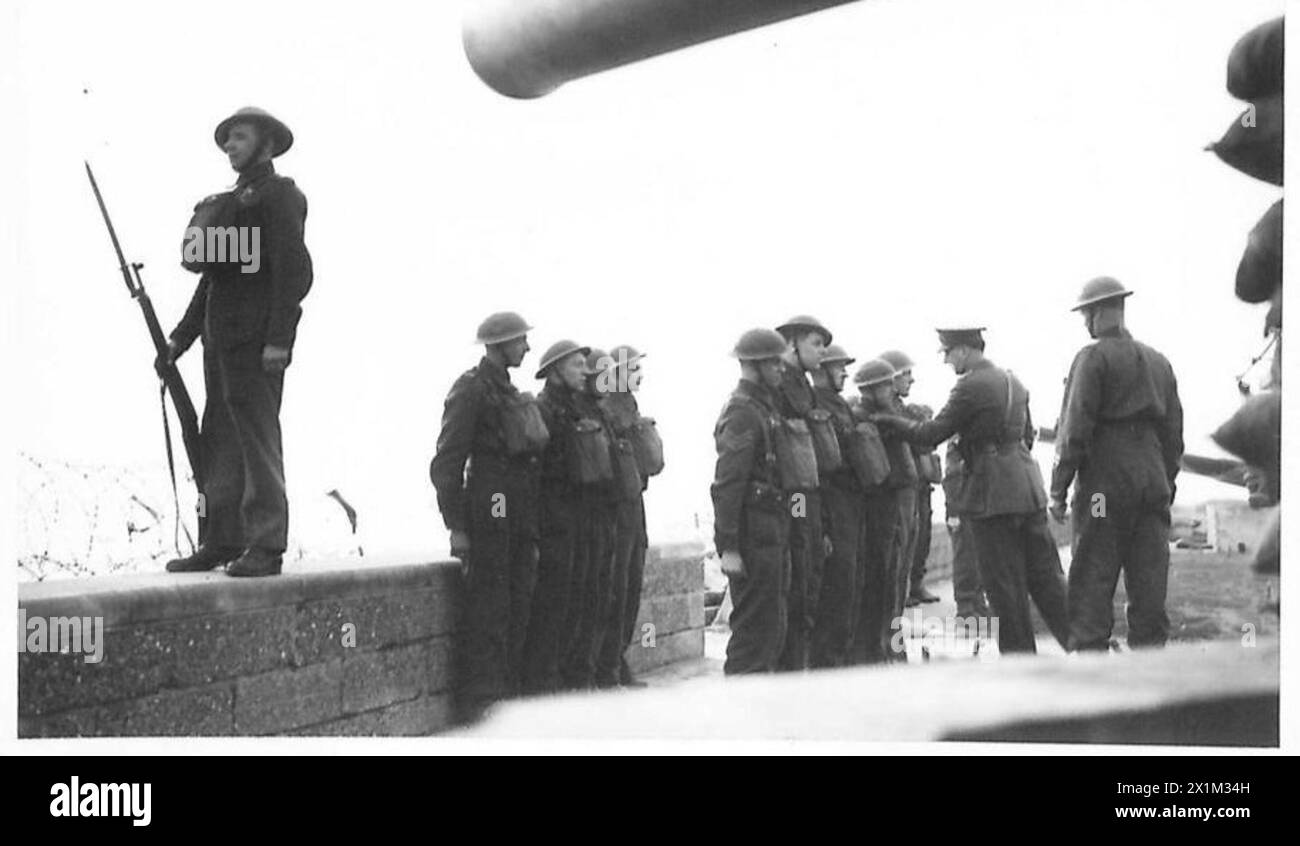 Personnel conduct an equipment inspection at a battery, illustrating ...