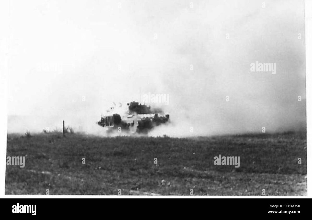 Scorpion mine beaters are shown clearing a minefield during a ...