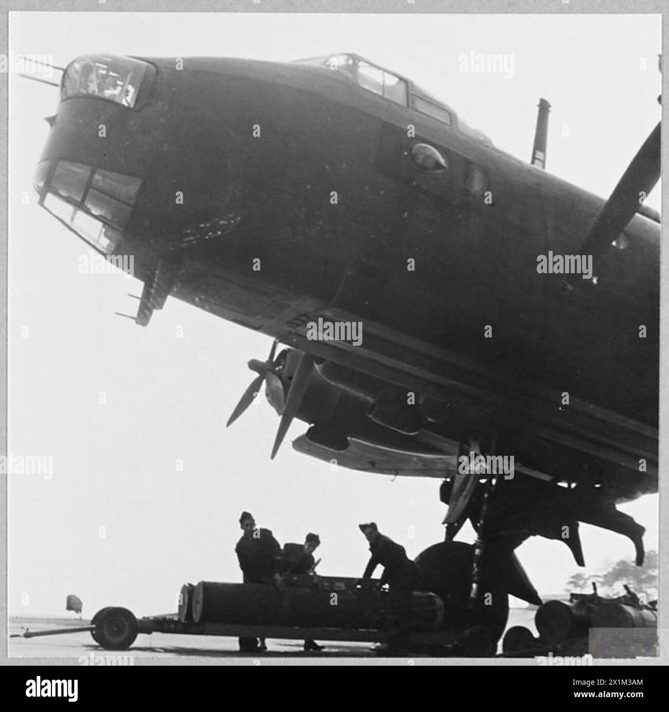 An RAF mining operation in 1944 where explosives are installed on ...