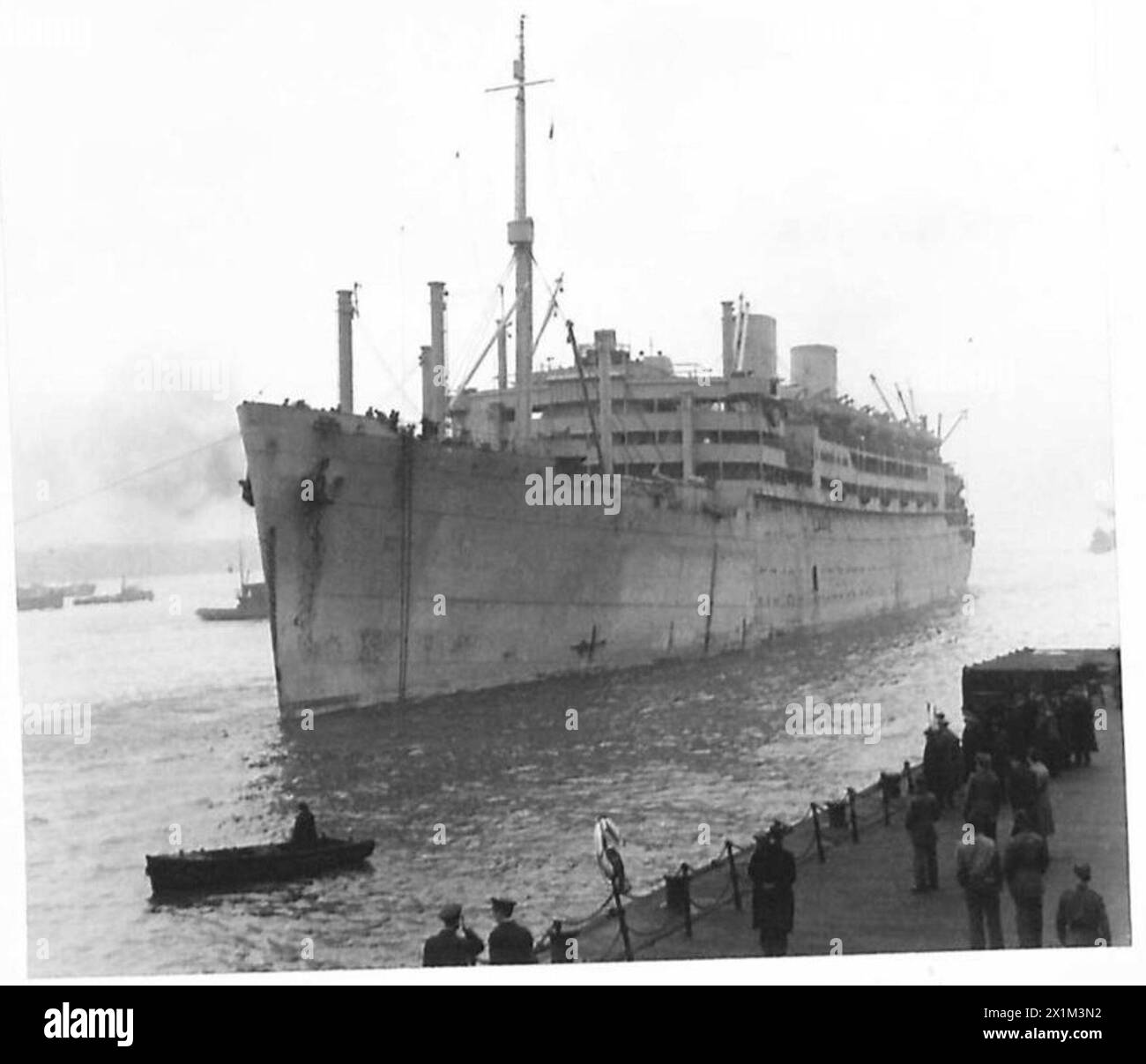 American troops arrive aboard the Dominian Monarch at a landing stage ...
