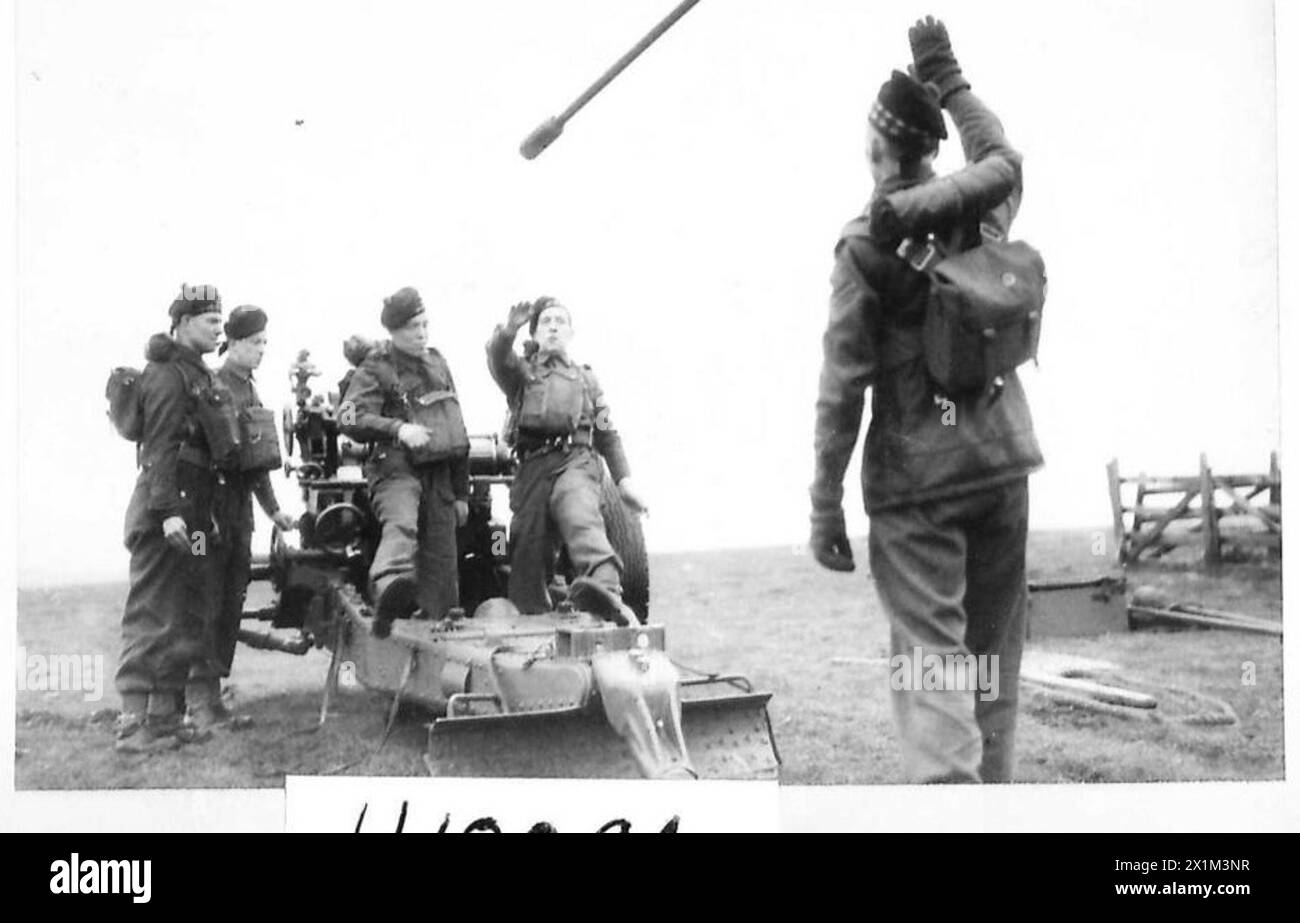 IN BONNIE SCOTLAND - Six inch Howitzers in action. The ramrod is seen ...