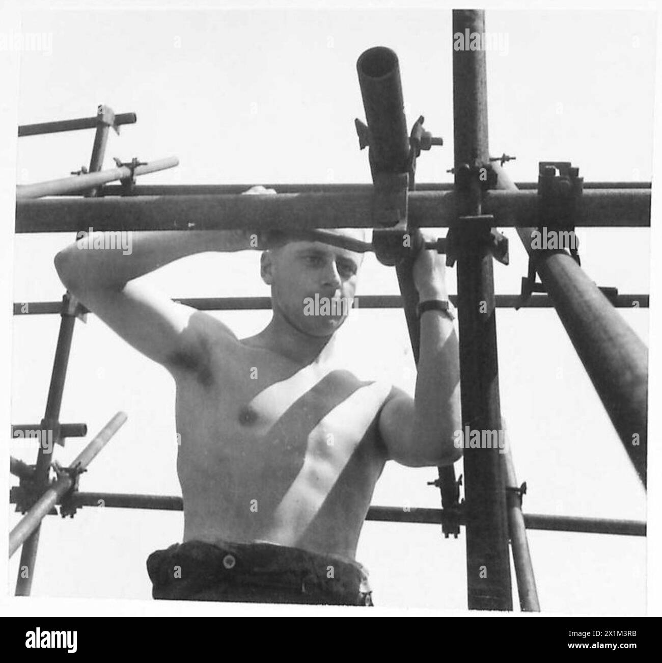 A battalion of the Northampton Regiment erects tubular steel ...