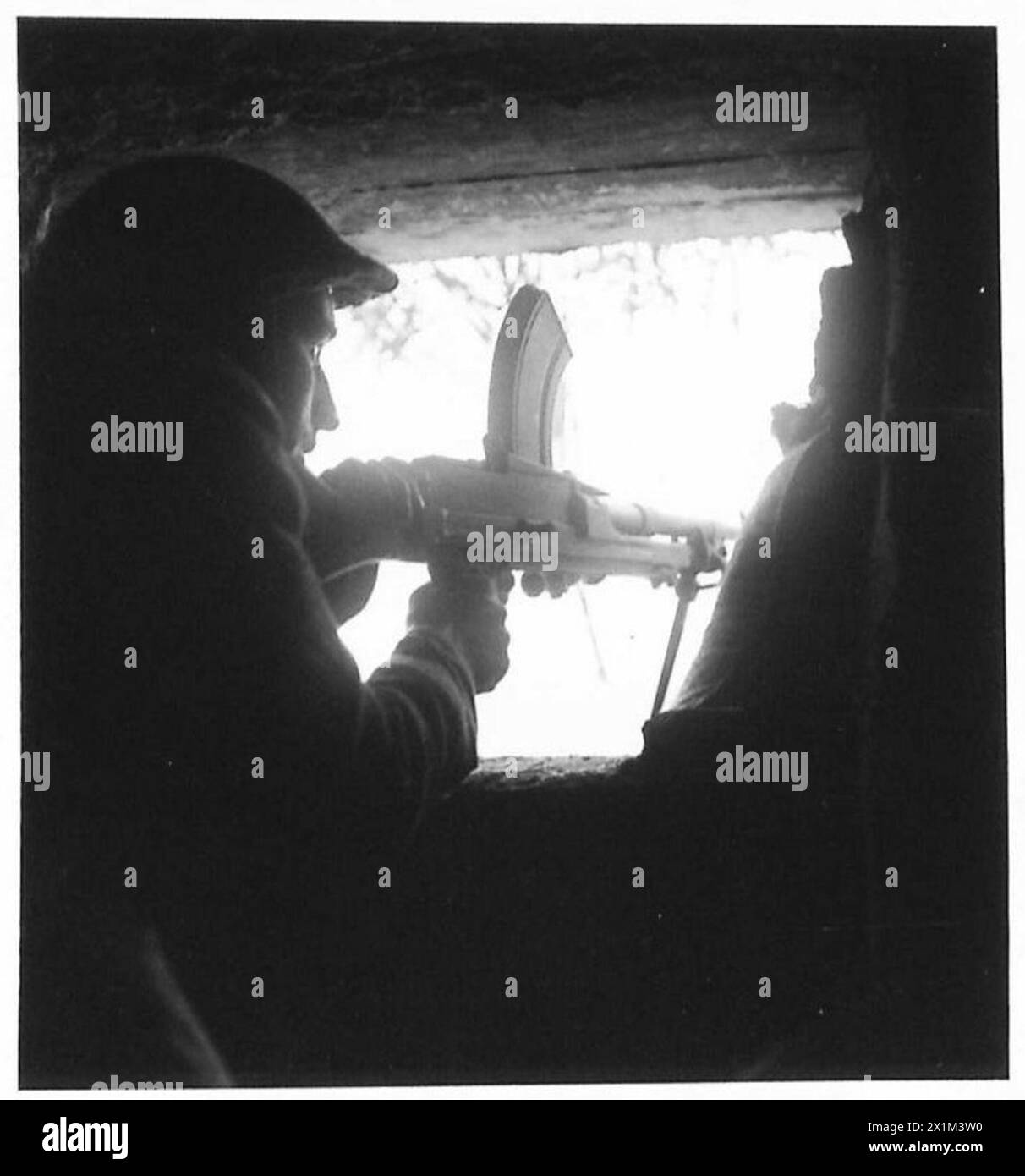 A Bren gunner fires from a captured pillbox during the Battle of the ...