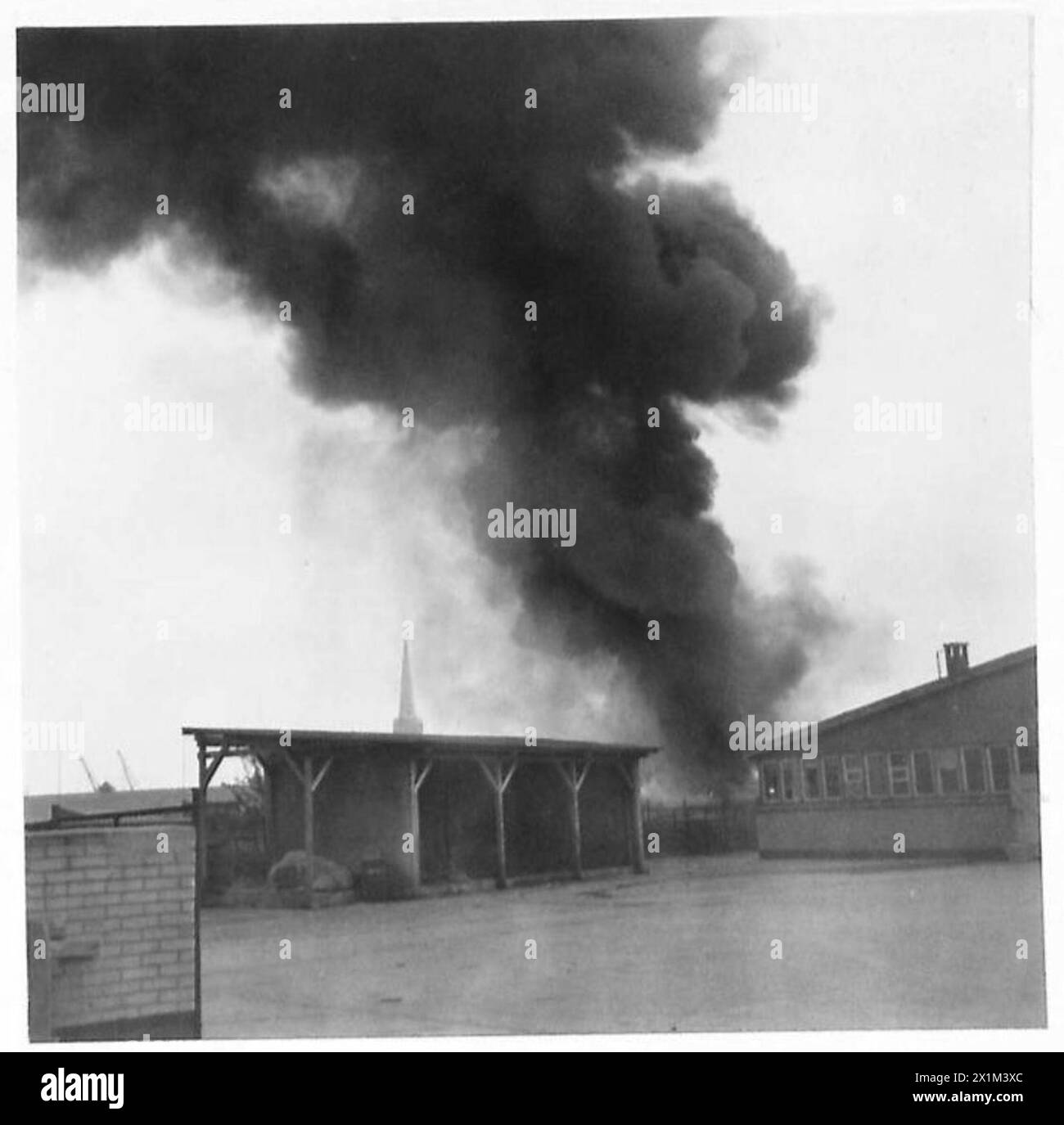ARMY FIRE SERVICE IN ACTION AT LUBECK - Clouds of smoke from the fire ...