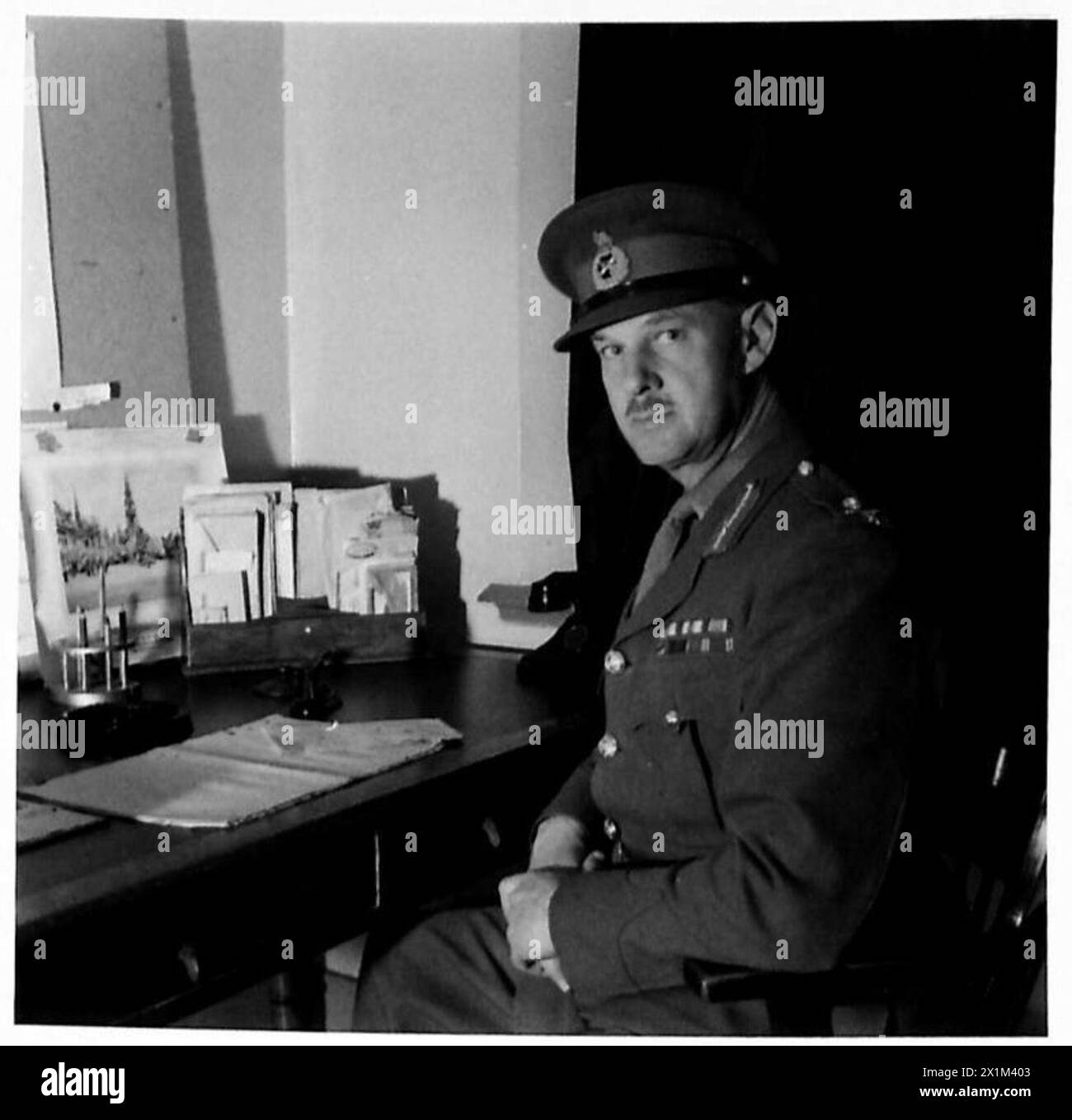 Major General L.M. Cox, OBE, MC, serves as Commander of the North Wales ...