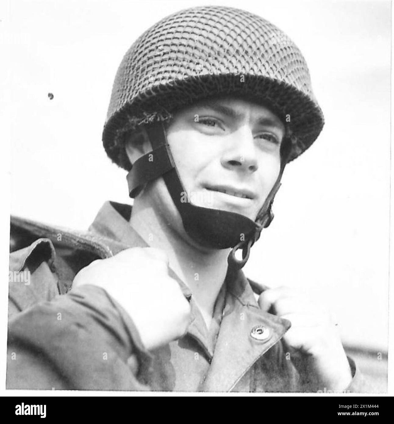 A paratroop trainee wears the latest type of helmet with chin pad ...