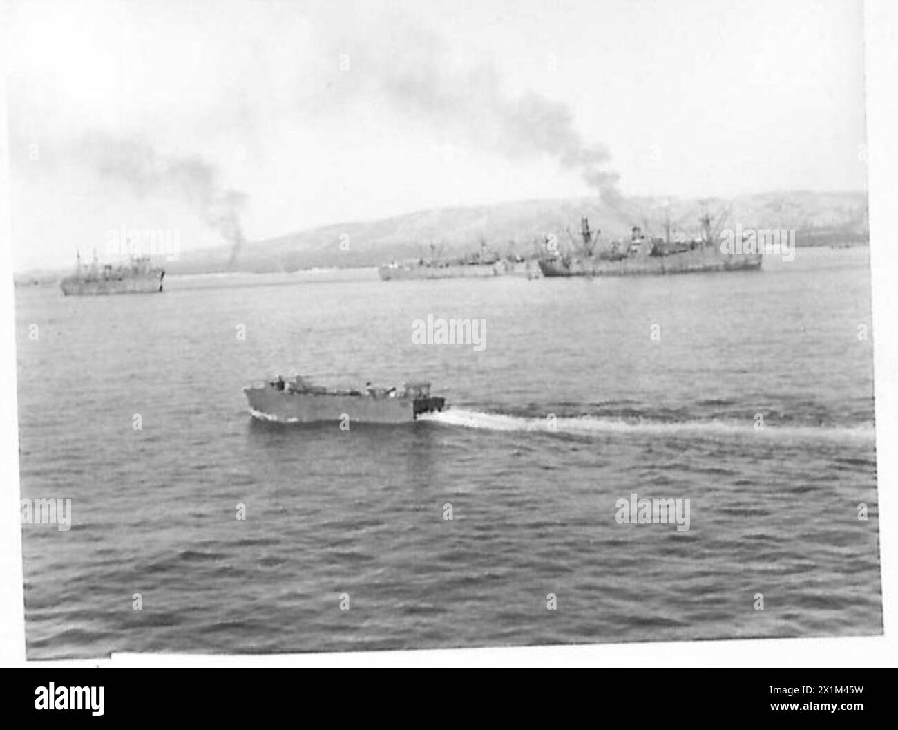 The convoy of H.M.S. Troop Ship Dunera arrives at Charlie Beach, Sicily ...
