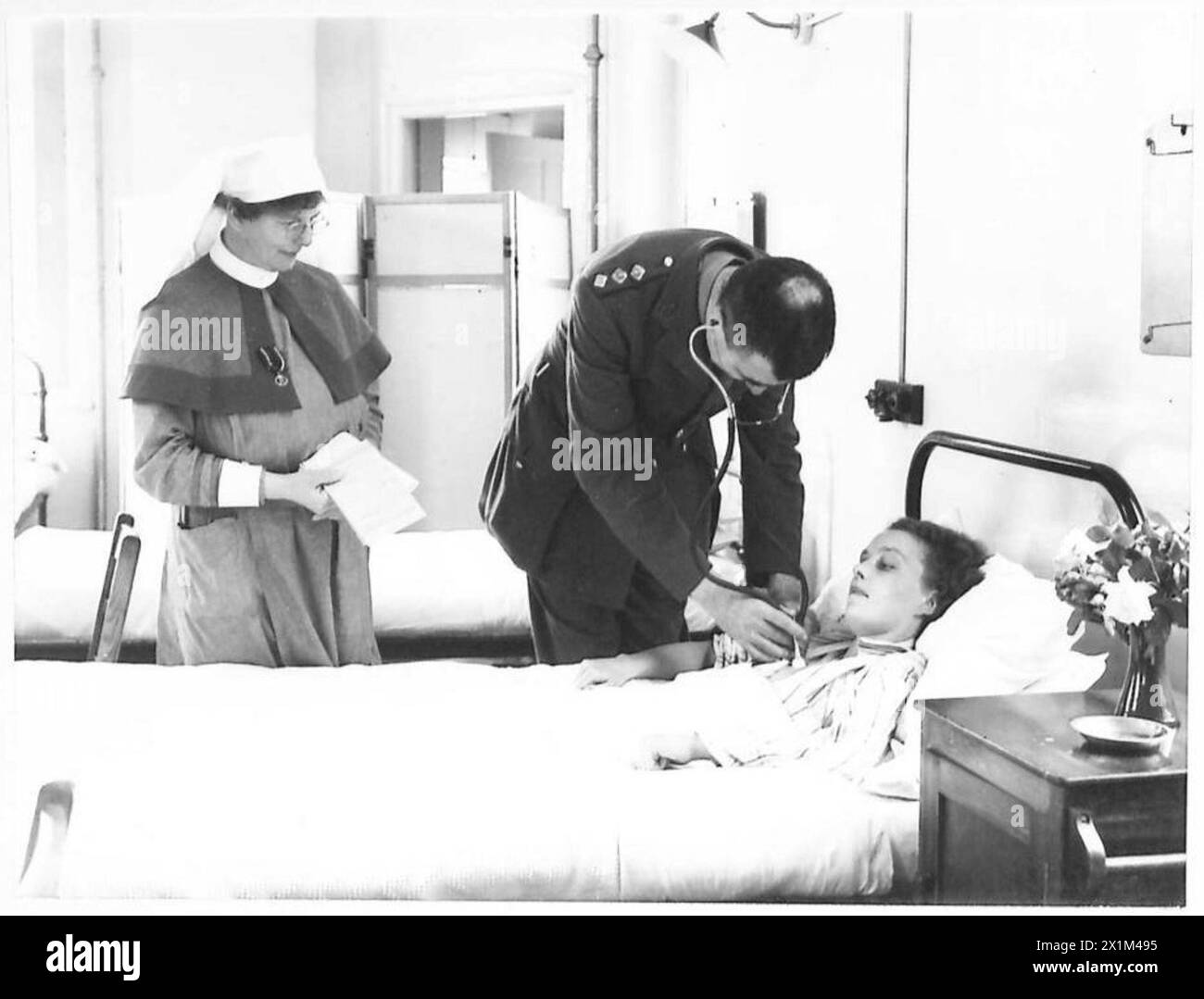 AT AN A.T.S. TRAINING CENTRE - An ATS patient is examined by the ...