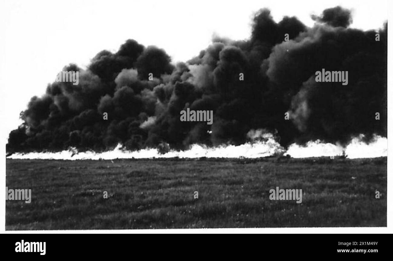 A flame barrage demonstration shows the controlled burning of oil to ...