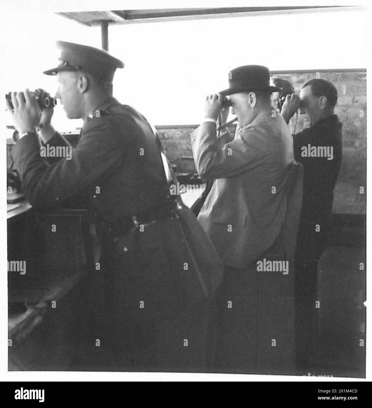 Prime Minister Winston Churchill and King Peter observe the firing of a ...