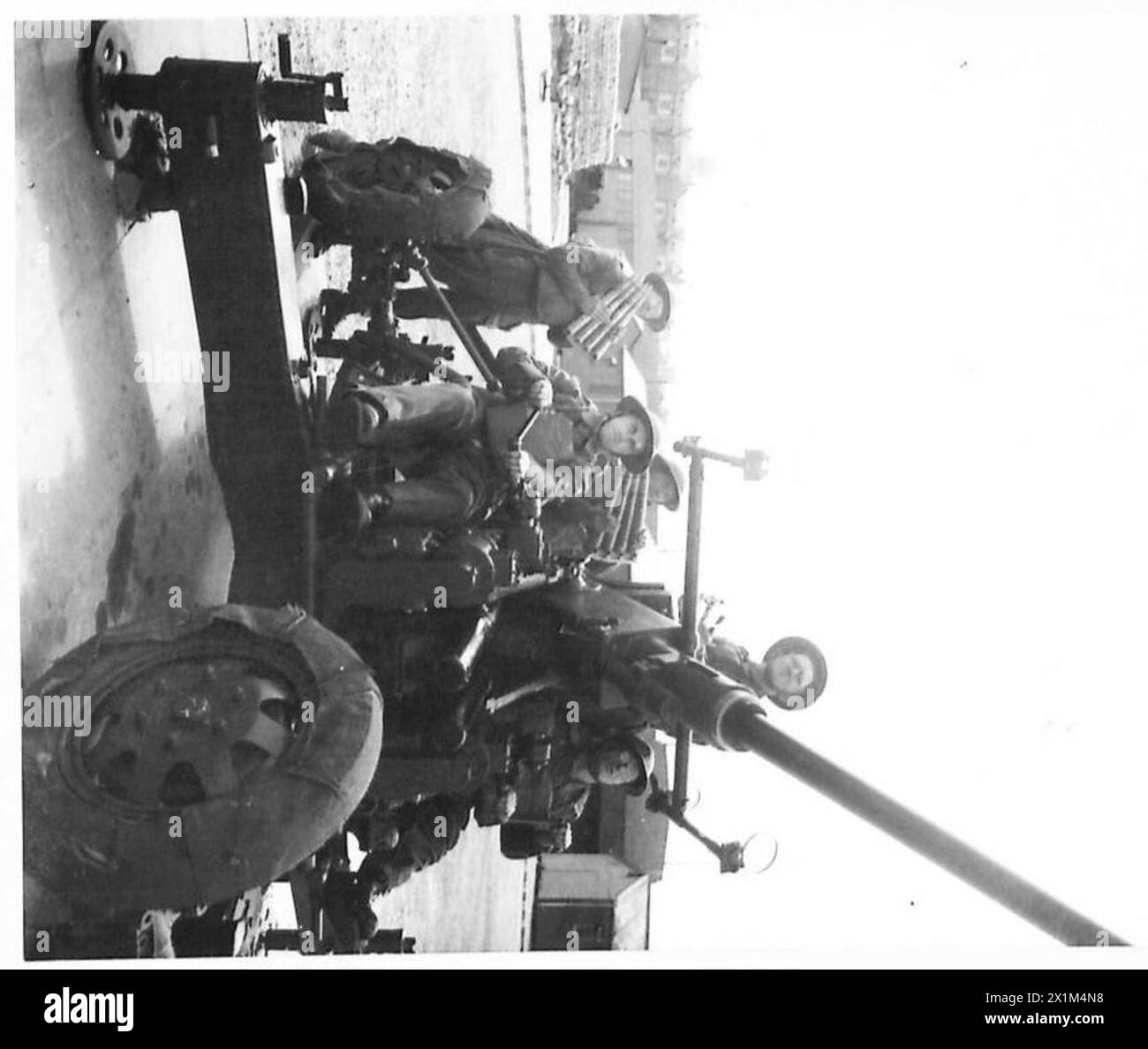 THE LIGHT A.A. DEFENCES OF MERSEYSIDE - The gun crews in action. Note ...