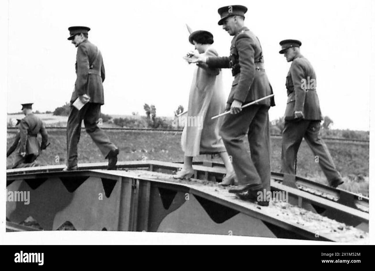 THE KING AND QUEEN'S VISIT TO SOUTHERN COMMAND - The Queen crossing a ...