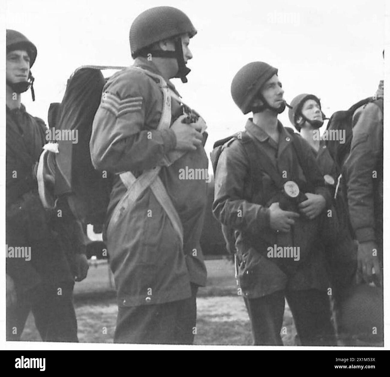 PARATROOPS IN TRAINING - Paratroops fully dressed and ready to emplane ...