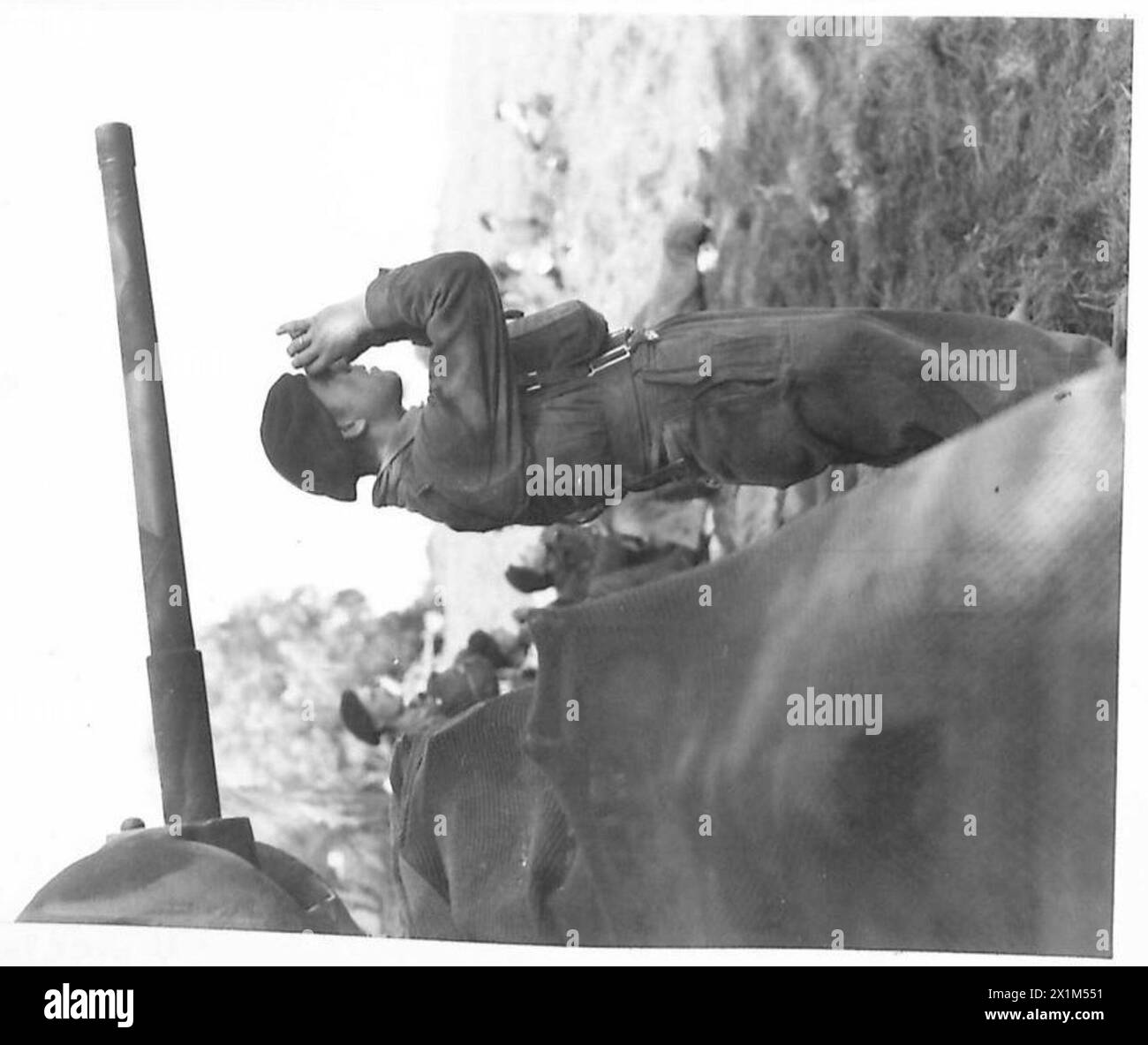 AN EXERCISE IN KENT - One of the crew of the Matilda tank keeps a ...