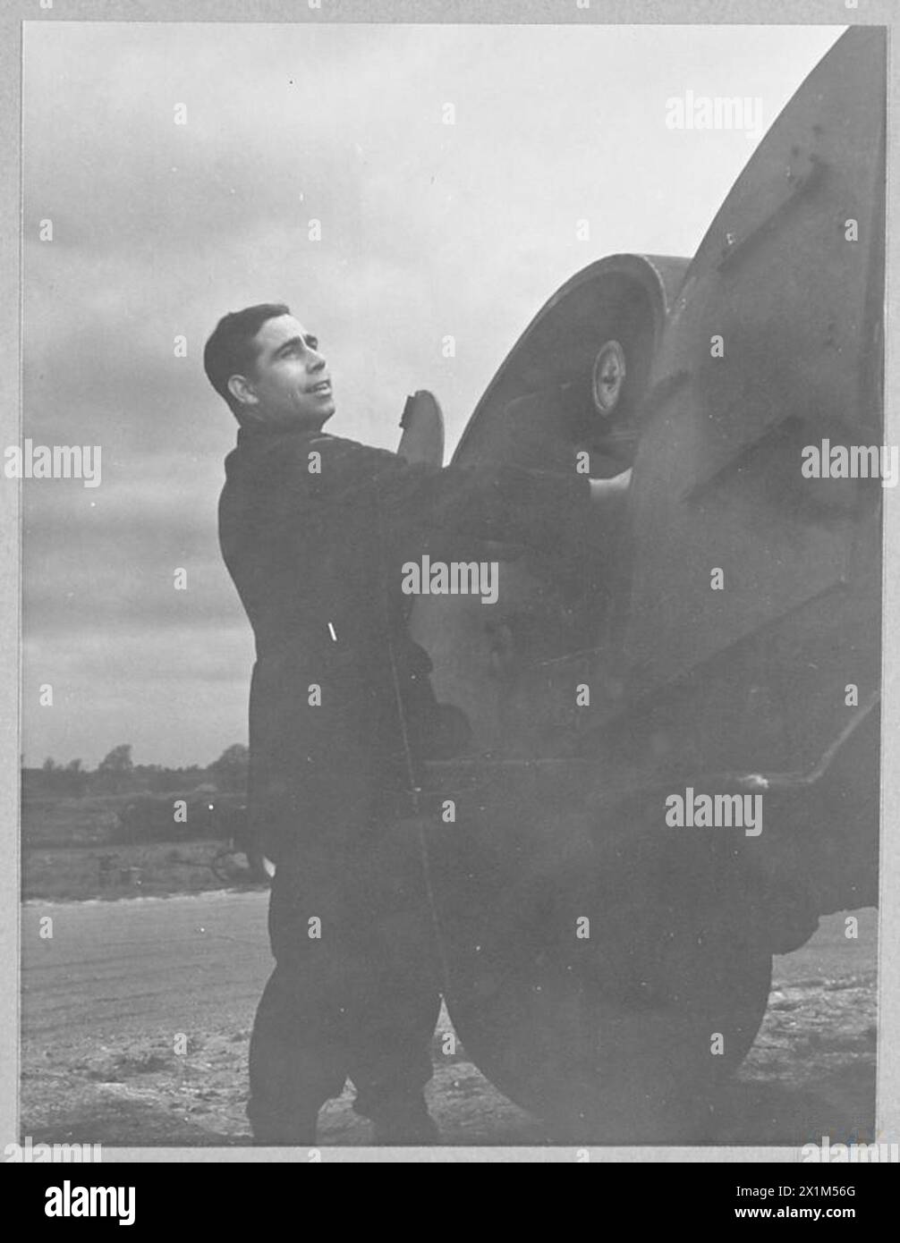 Clarkie Clarkson of Leeds, bowser pump operator, fills Spitfire tanks ...