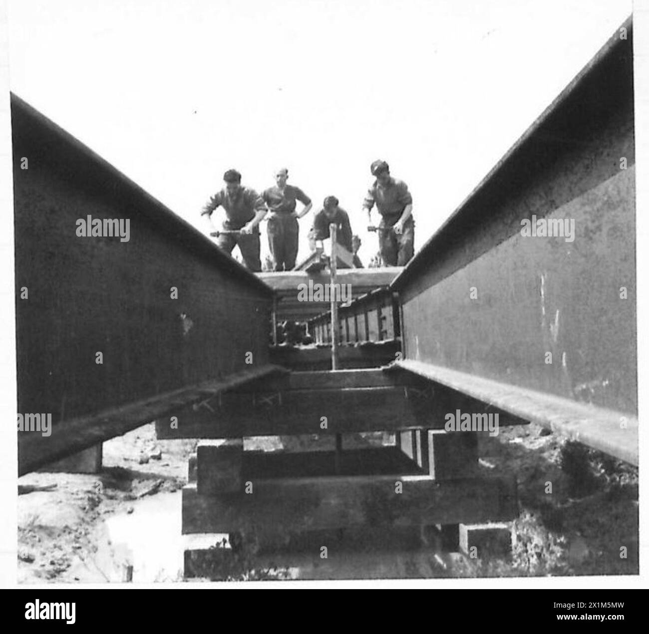 A MILITARY RAILWAY FOR TRAINING R.Es. - Railway track being laid on ...