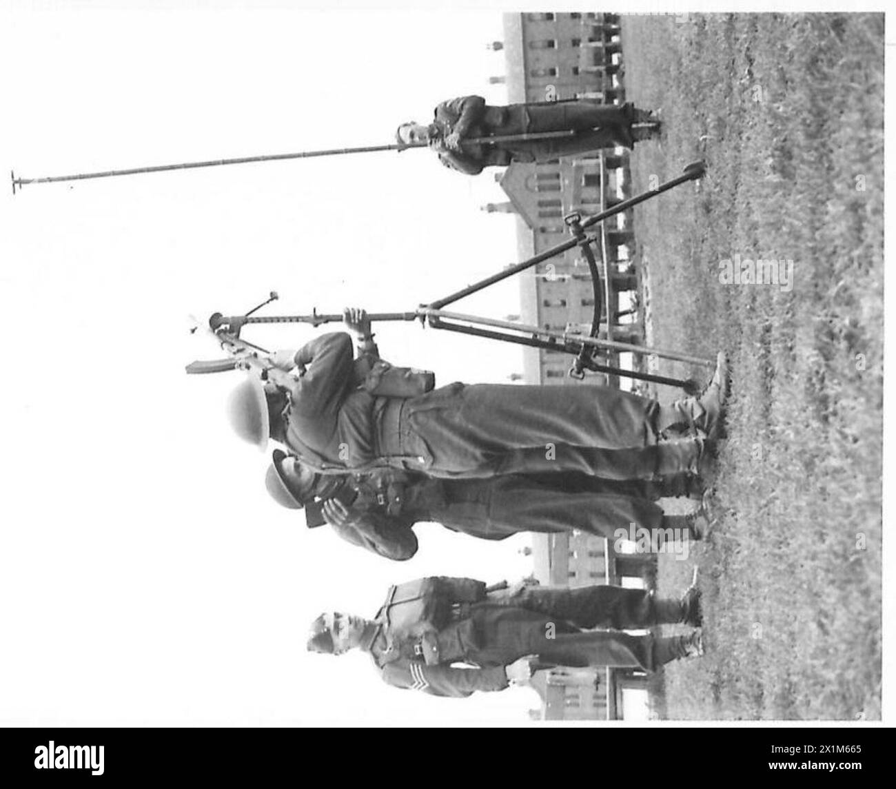 A British Army recruit practices aiming a Bren light machine gun at a ...