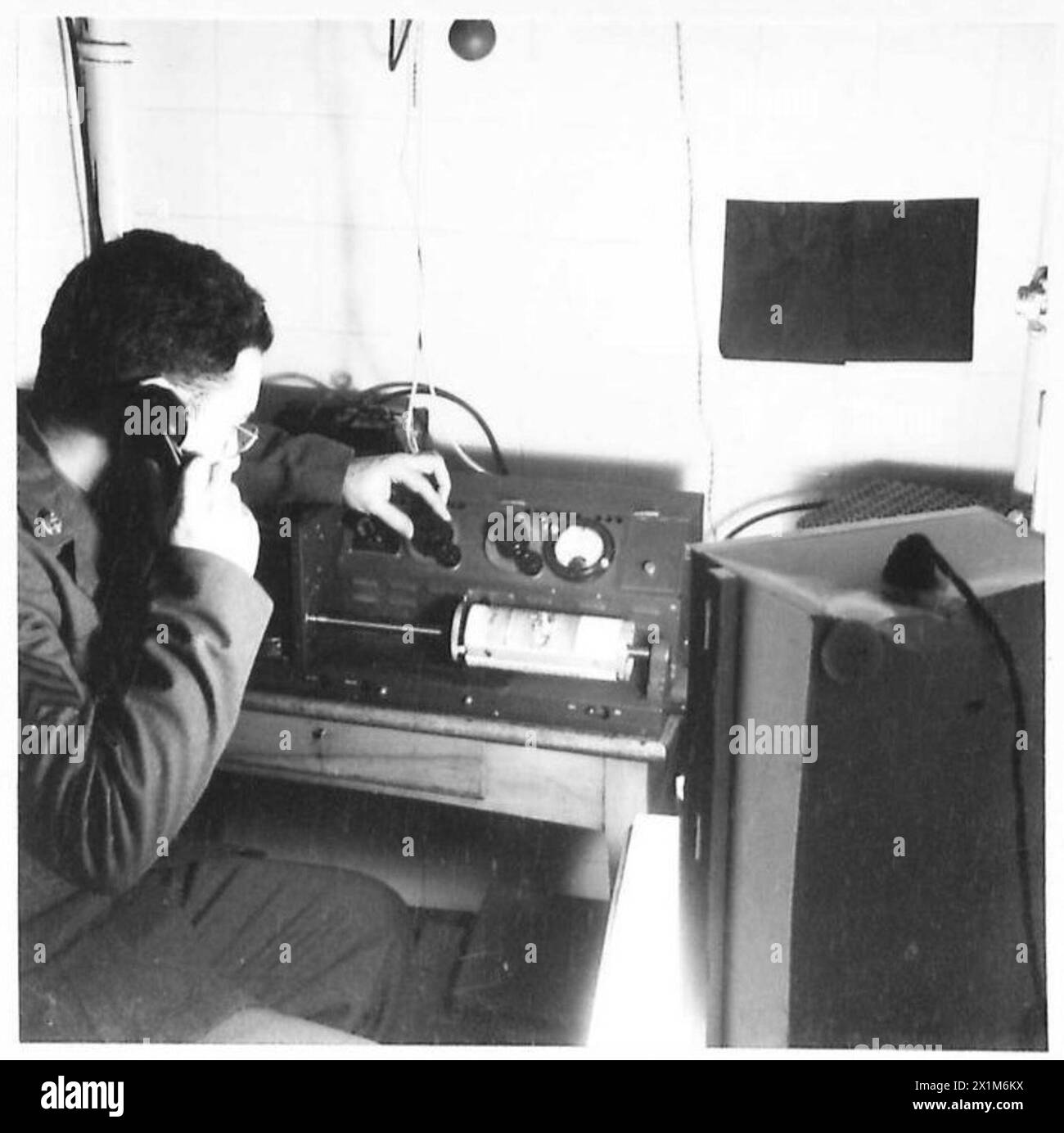 A U.S. Signal Corps telephoto transmitter installed in a hotel bathroom ...