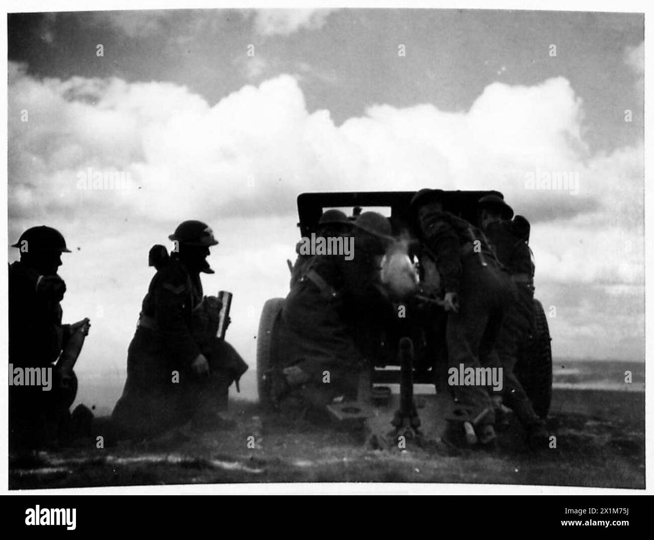 AN ARTILLERY SHOOT - One of the guns being loaded, British Army Stock ...