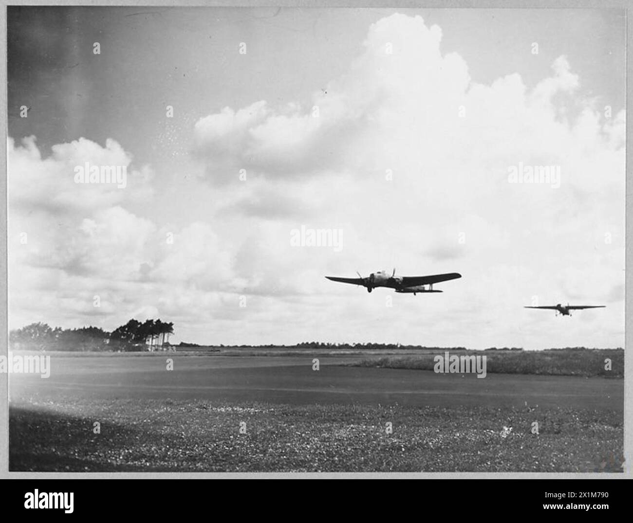 An RAF Whitley aircraft towing a Horsa glider carrying troops during ...