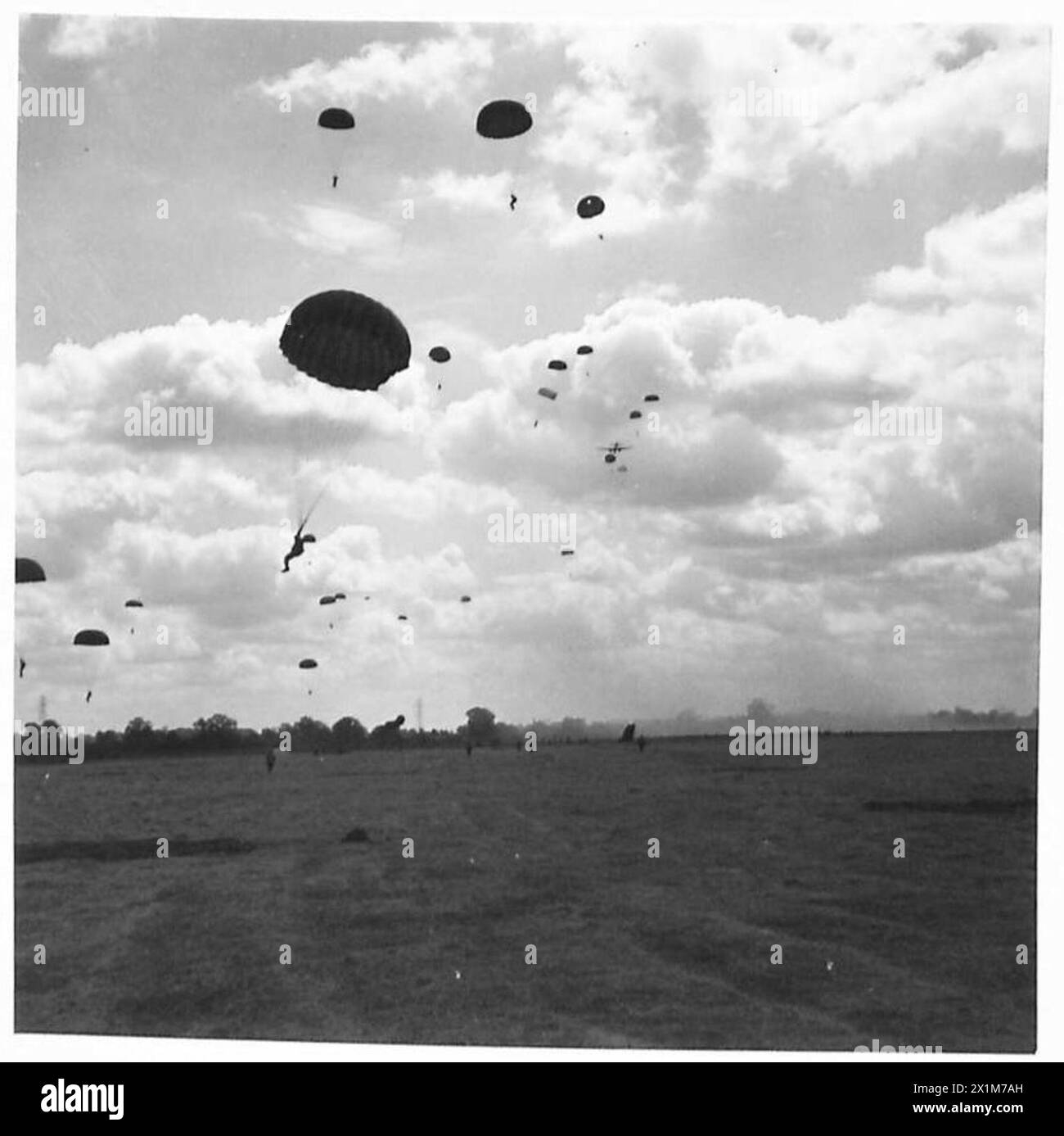 PARATROOPS IN TRAINING - A massed descent by paratroops who had earned ...
