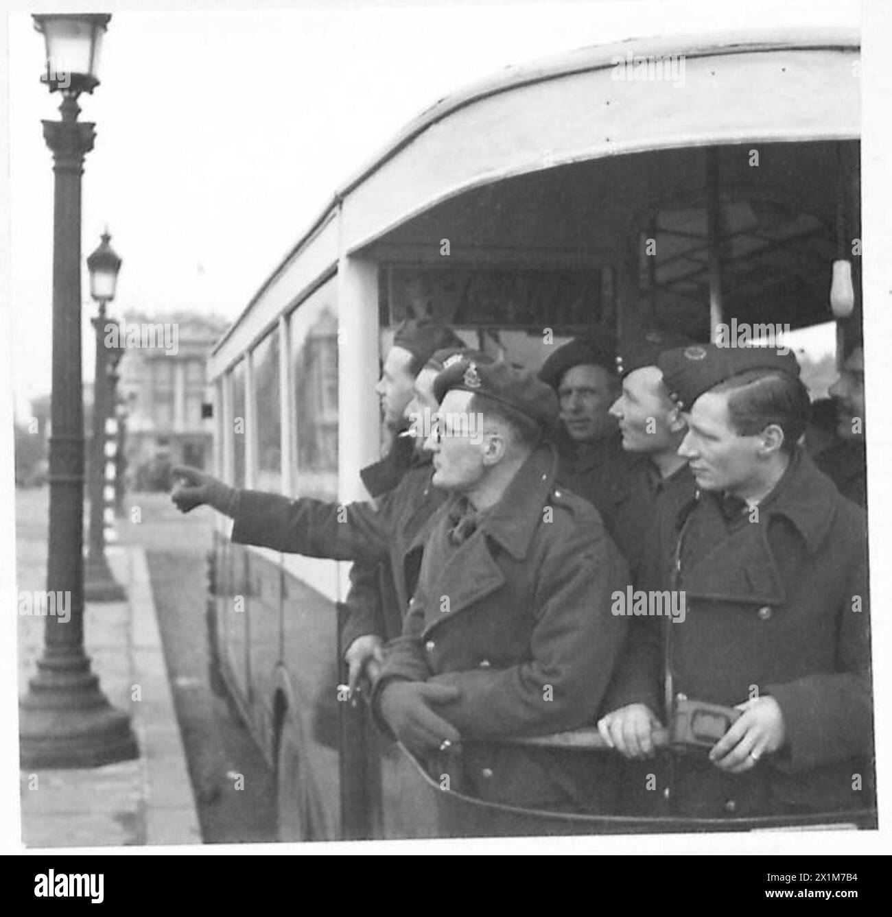 SOLDIER TOURISTS - From the platform of a Paris bus the soldiers pick ...