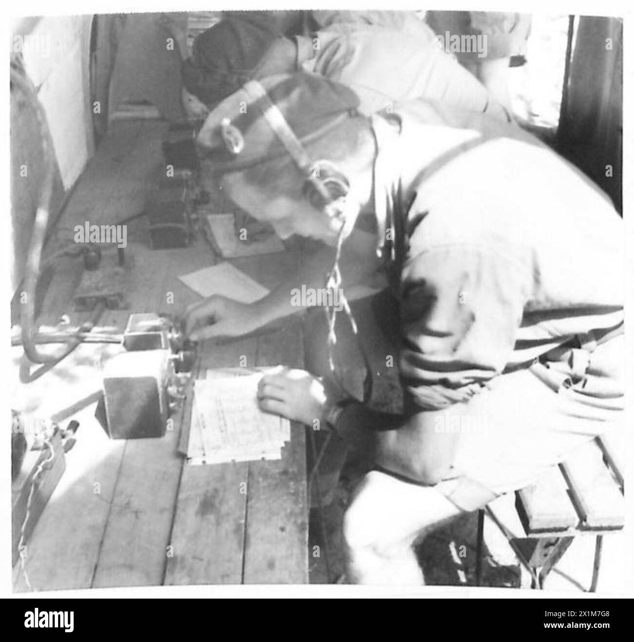 A signalman operates Morse code communications from an armoured command ...