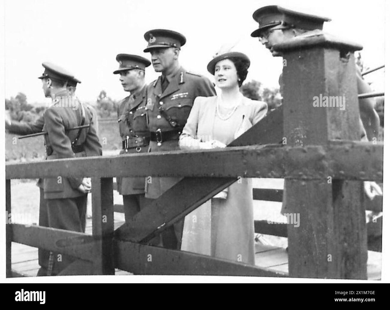 The King and Queen observe bridging operations during army manoeuvres ...