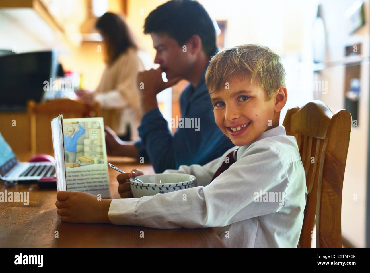 Portrait, child and book in home with breakfast for reading or learning ...