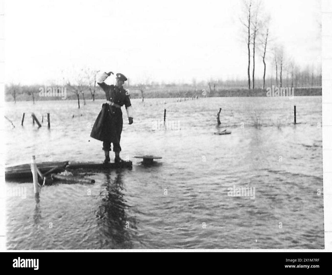 RIVER MEUSE IN FLOOD (BRIDGE AT BERG) - This MP is almost marooned: he ...
