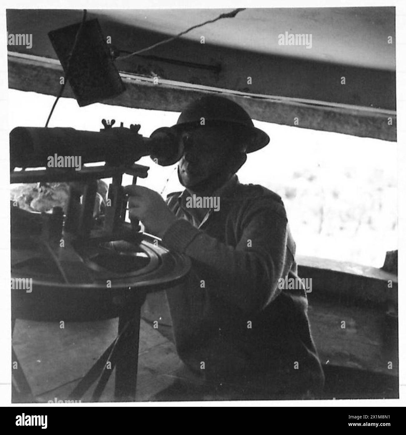 A British coast battery in Lebanon uses an instrument to measure and ...