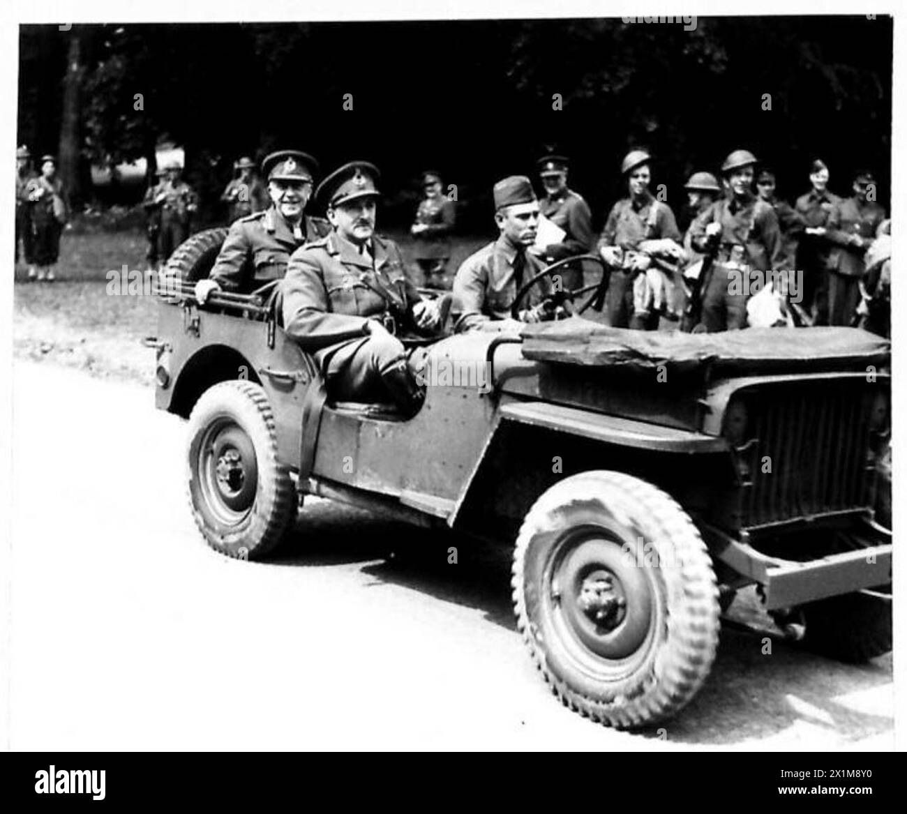 Gen. Sir Alan Brooke conducts a routine inspection while riding in a U ...