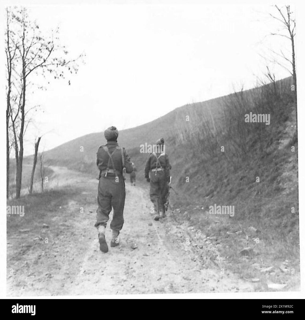 FIFTH ARMY : VARIOUS - The patrol moves cautiously along the road ...