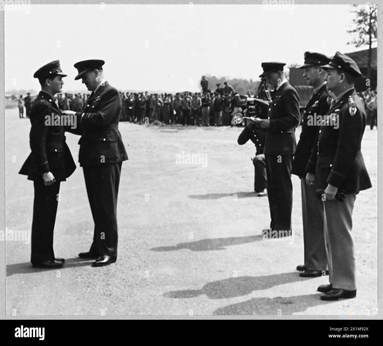 Air Chief Marshal Sir Trafford Leigh-Mallory of the RAF awards the ...