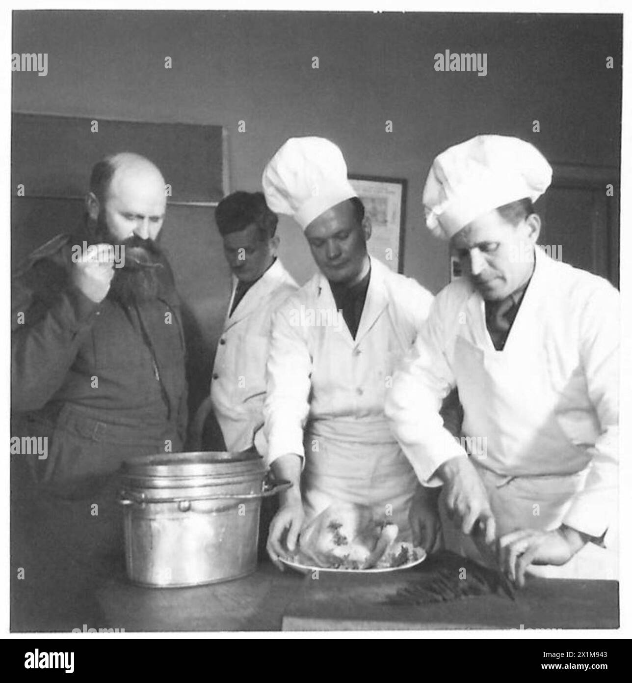 A sergeant of the 1st Brigade officers' messroom tastes soup prepared ...