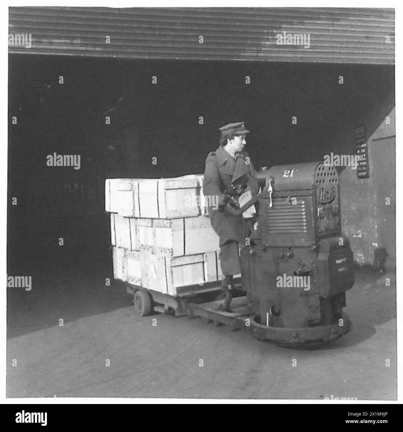 An ATS girl operates a Lister machine at Chilwell Ordnance Depot, with ...