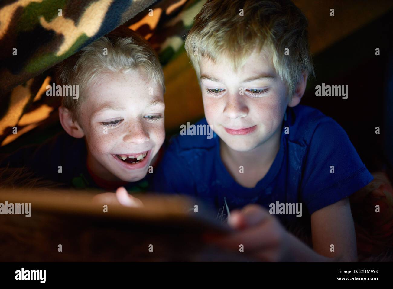 Smile, kids and brothers on tablet in tent at home for game, movie or ...