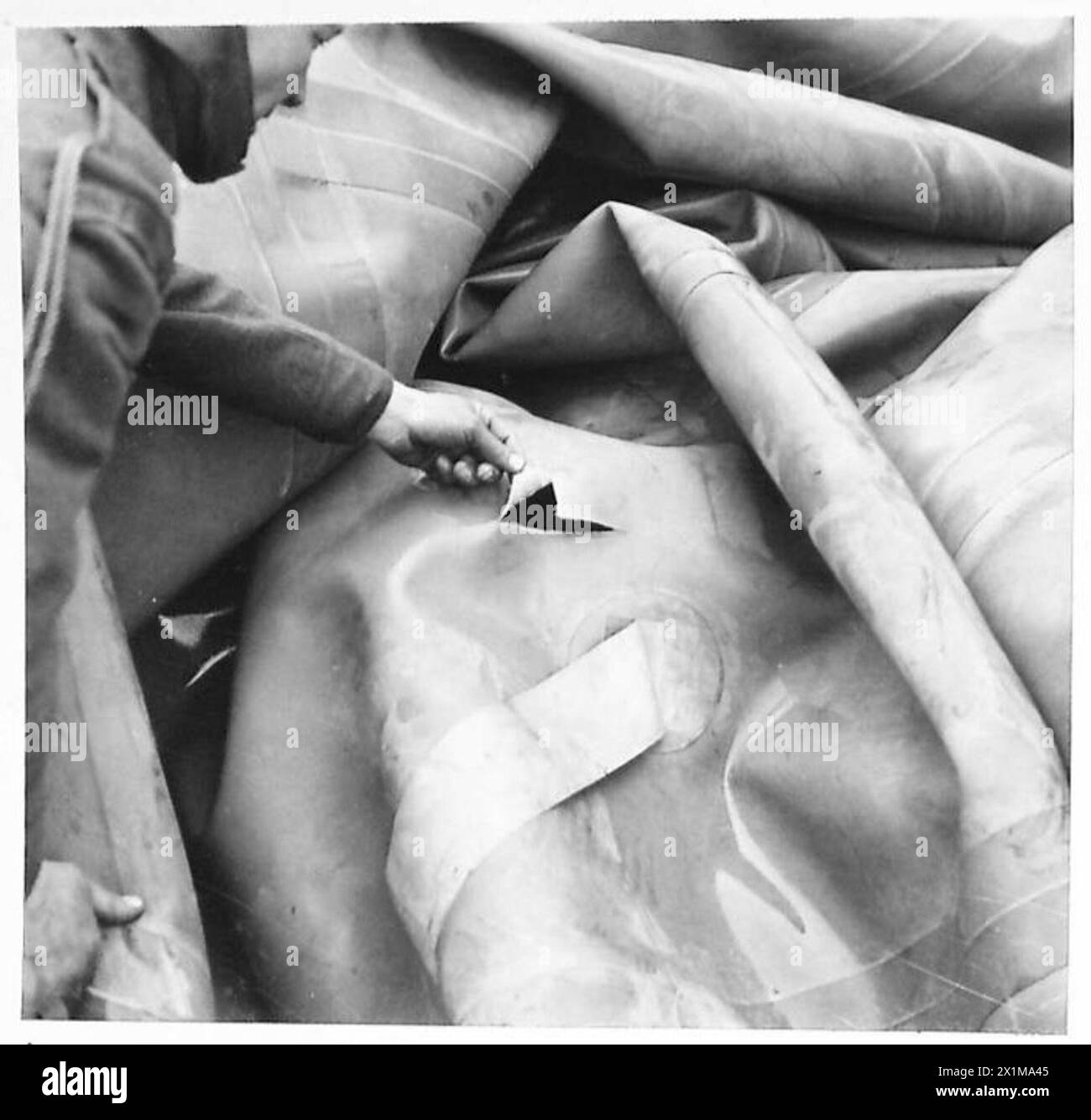 Photographs depict a beadle flooded and lifted using air balloons ...