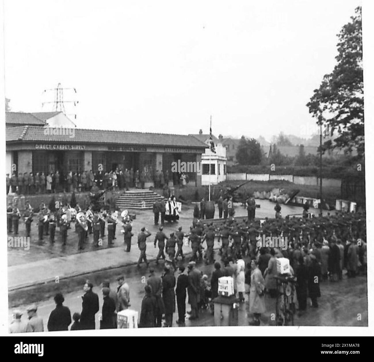 Troops of the British Army march past the saluting base following a ...