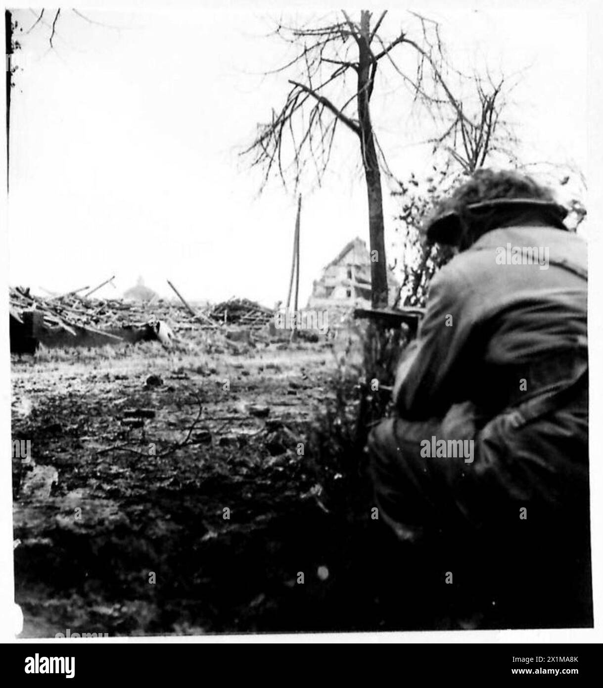 British troops advance through the damaged town of Kleve, with tanks ...