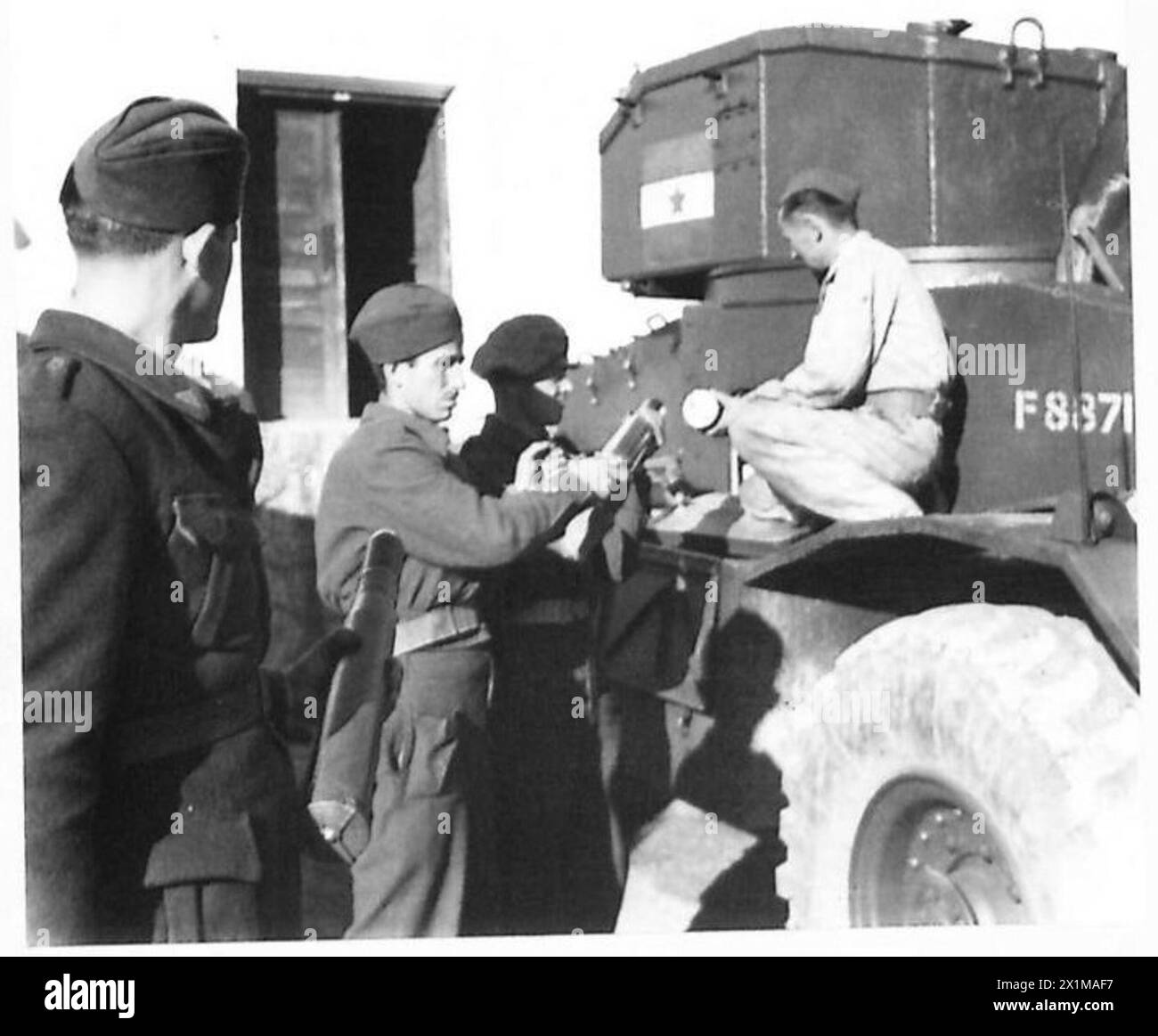 YUGOSLAVIA : VARIOUS - Loading 6-pounder shells into an armoured car ...