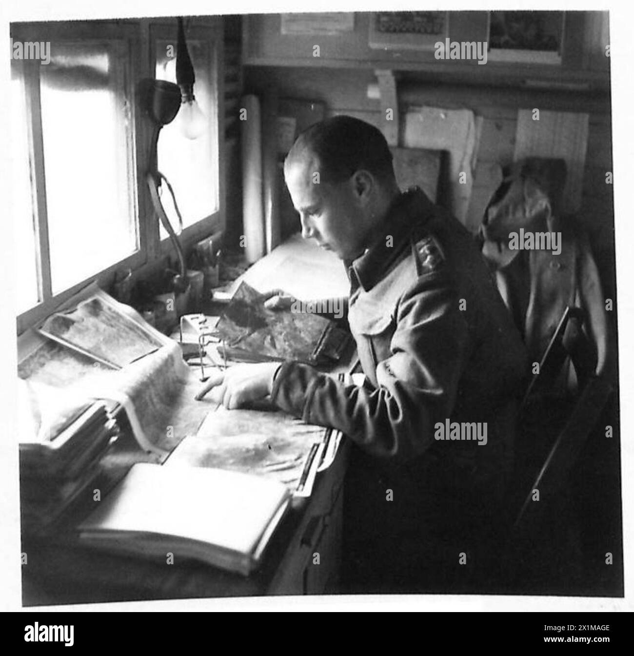 ITALY : EIGHTH ARMY - Capt. A. Haward of Osterley, Middlesex, working ...