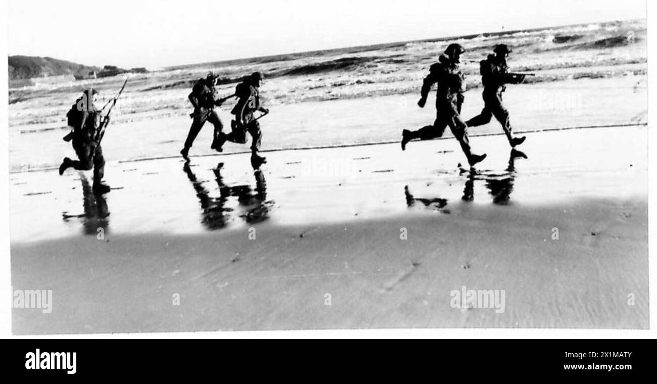NORWEGIAN FORCES ON EXERCISES - Infantry advancing along the beach to ...