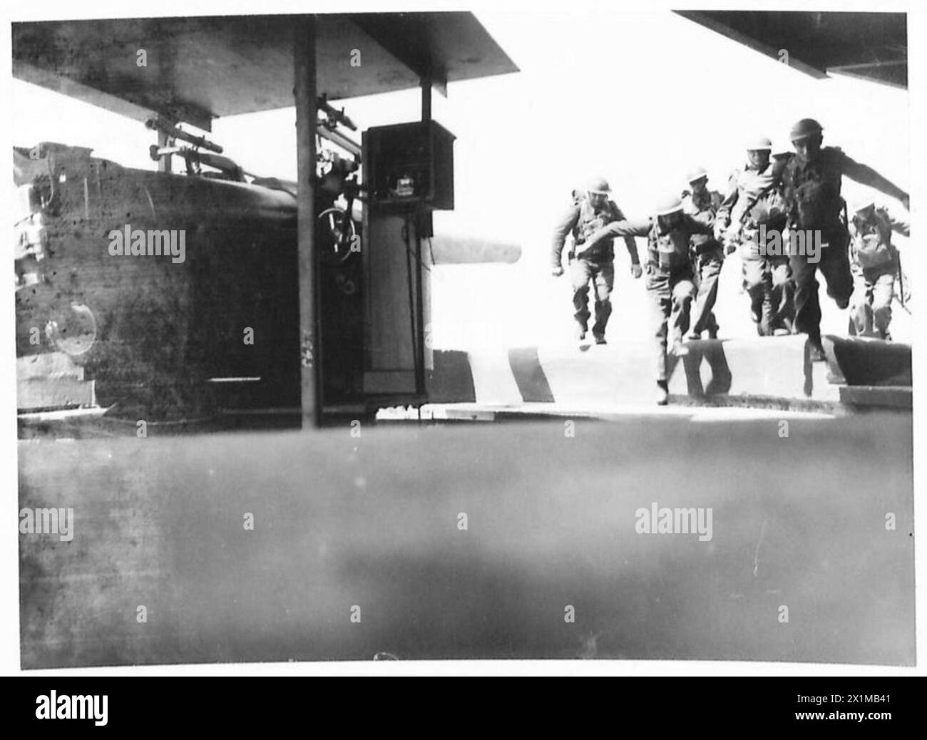 BRITAIN S DEFENCES - "Action Stations". The gun crews double to their ...