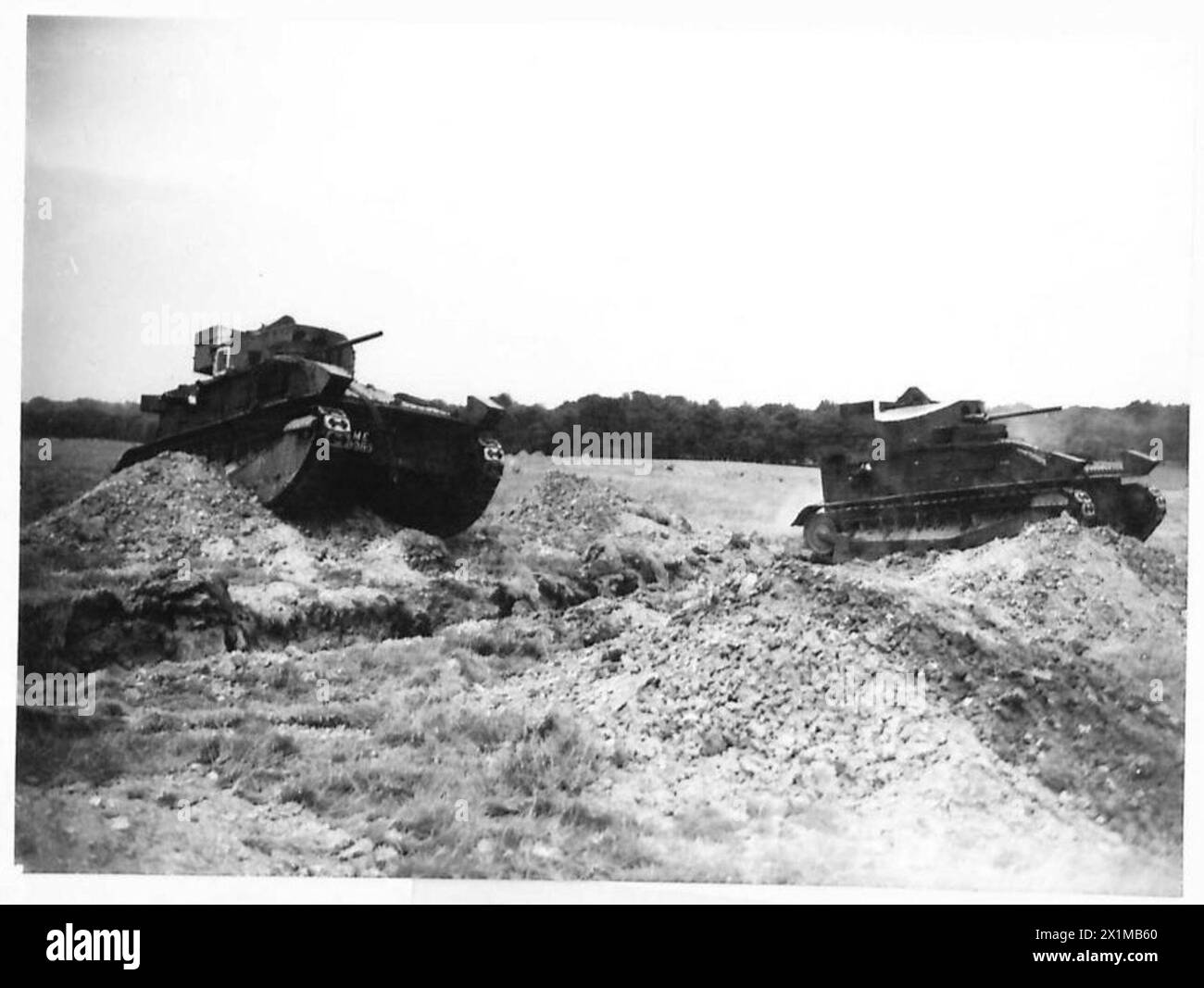 Two tanks from the Royal Tank Regiment negotiate obstacles during ...