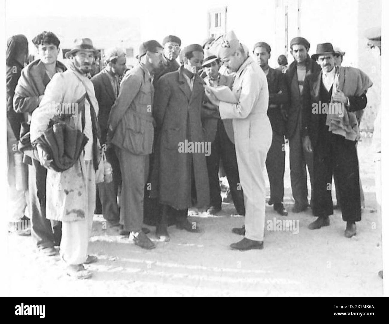 An Egyptian Warrant Officer verifies the identities of refugees from ...