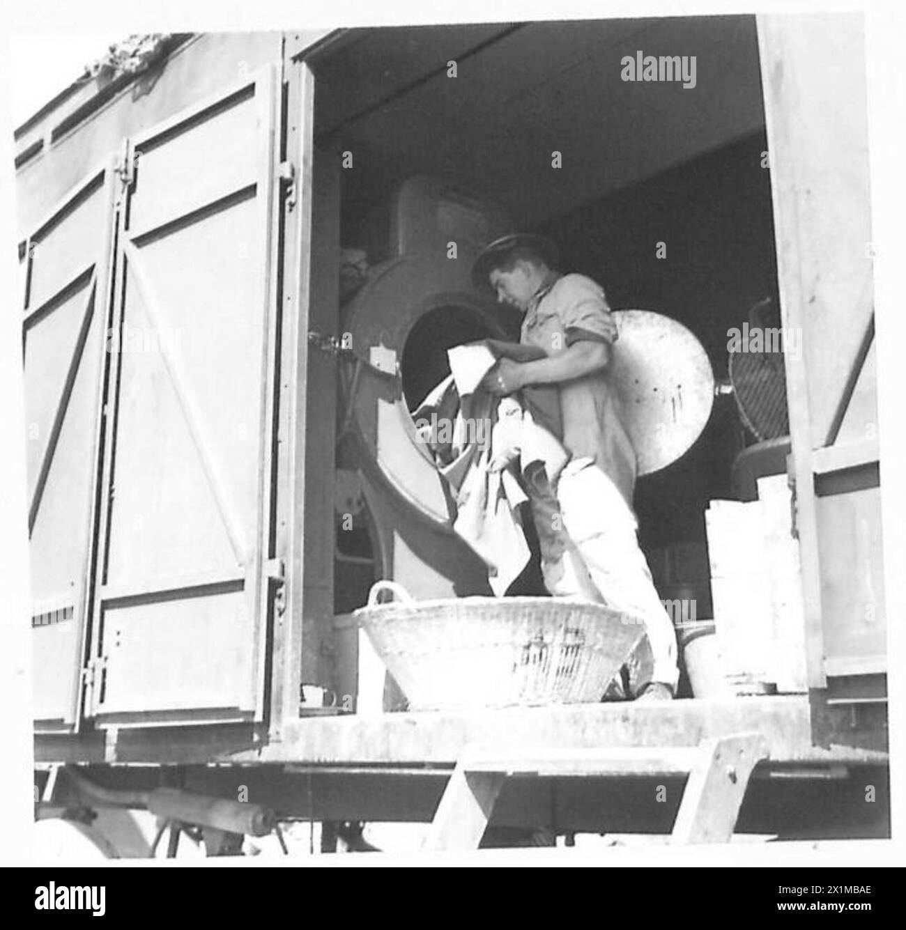 Private J. Smith operates a mobile field laundry at the Anzio ...