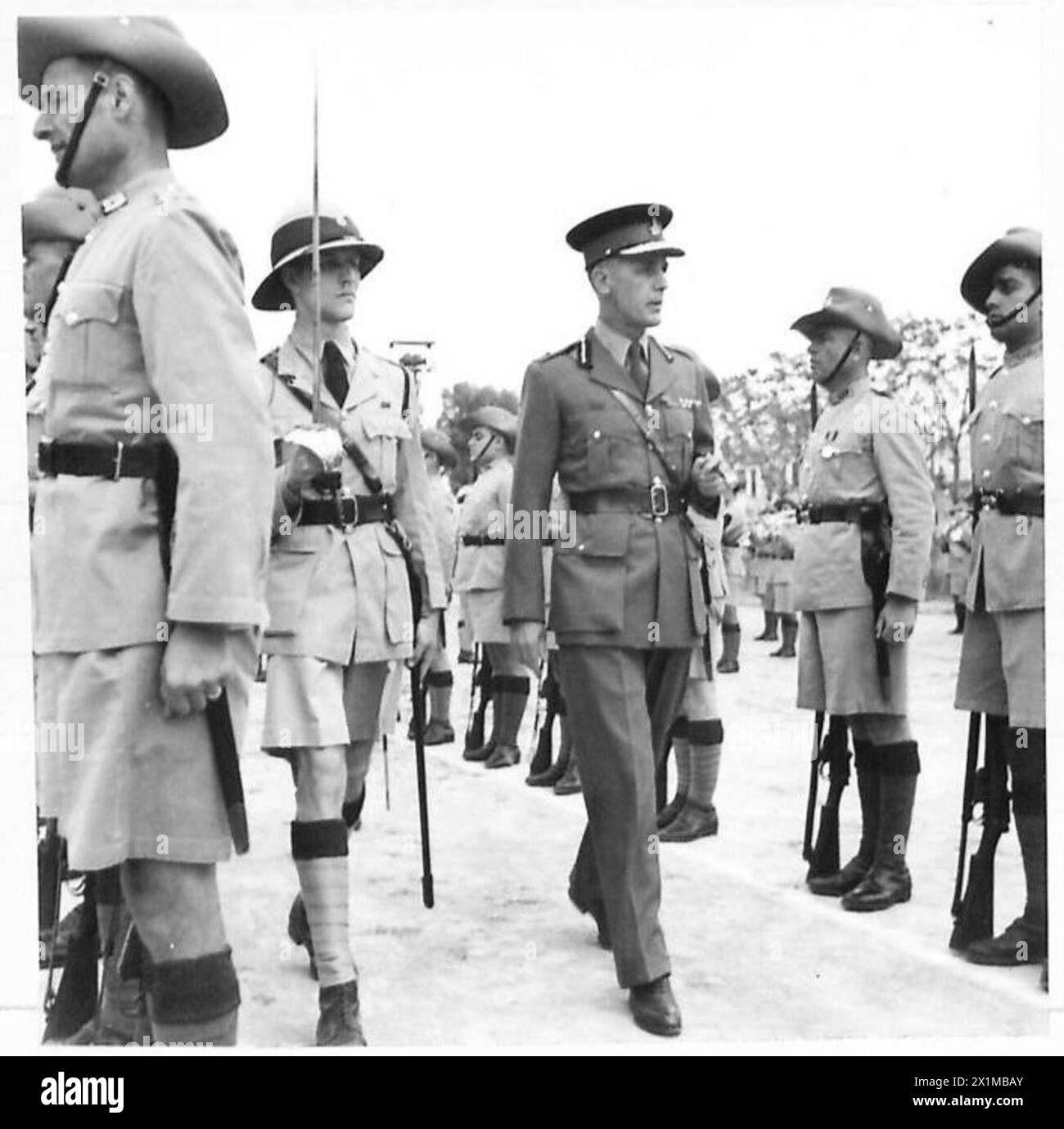 The Governor of Cyprus, C.C. Woolley, attends a Decoration Parade of ...